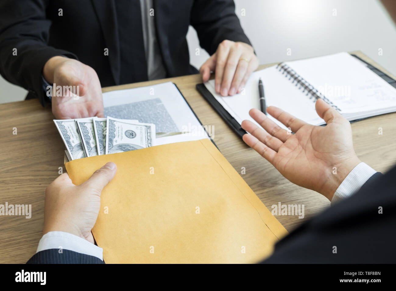 bribe and corruption concept, Corrupted businessman sealing the deal ...