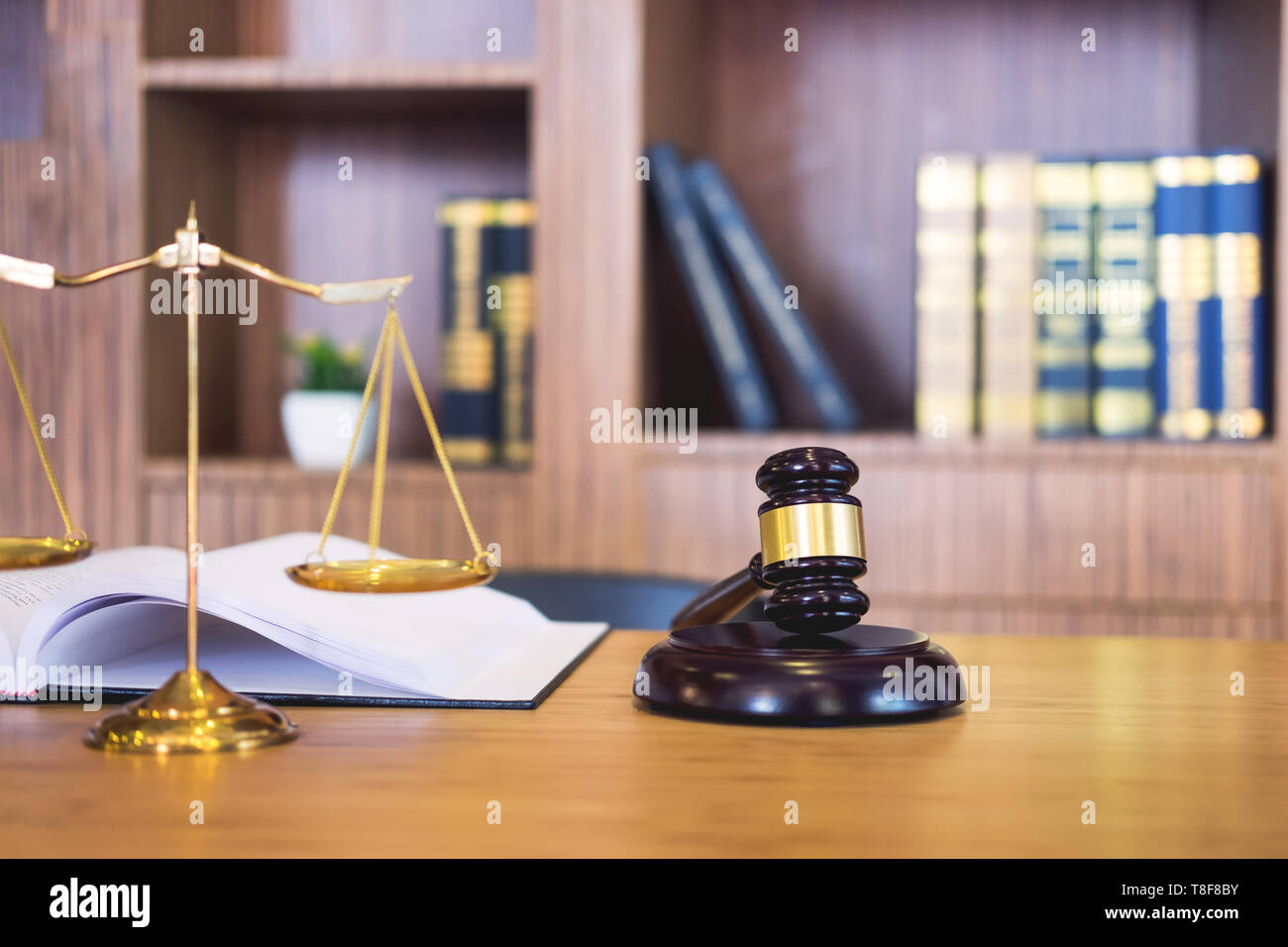 Symbol of Judge law attorney gavel with Justice lawyers table desktop ...