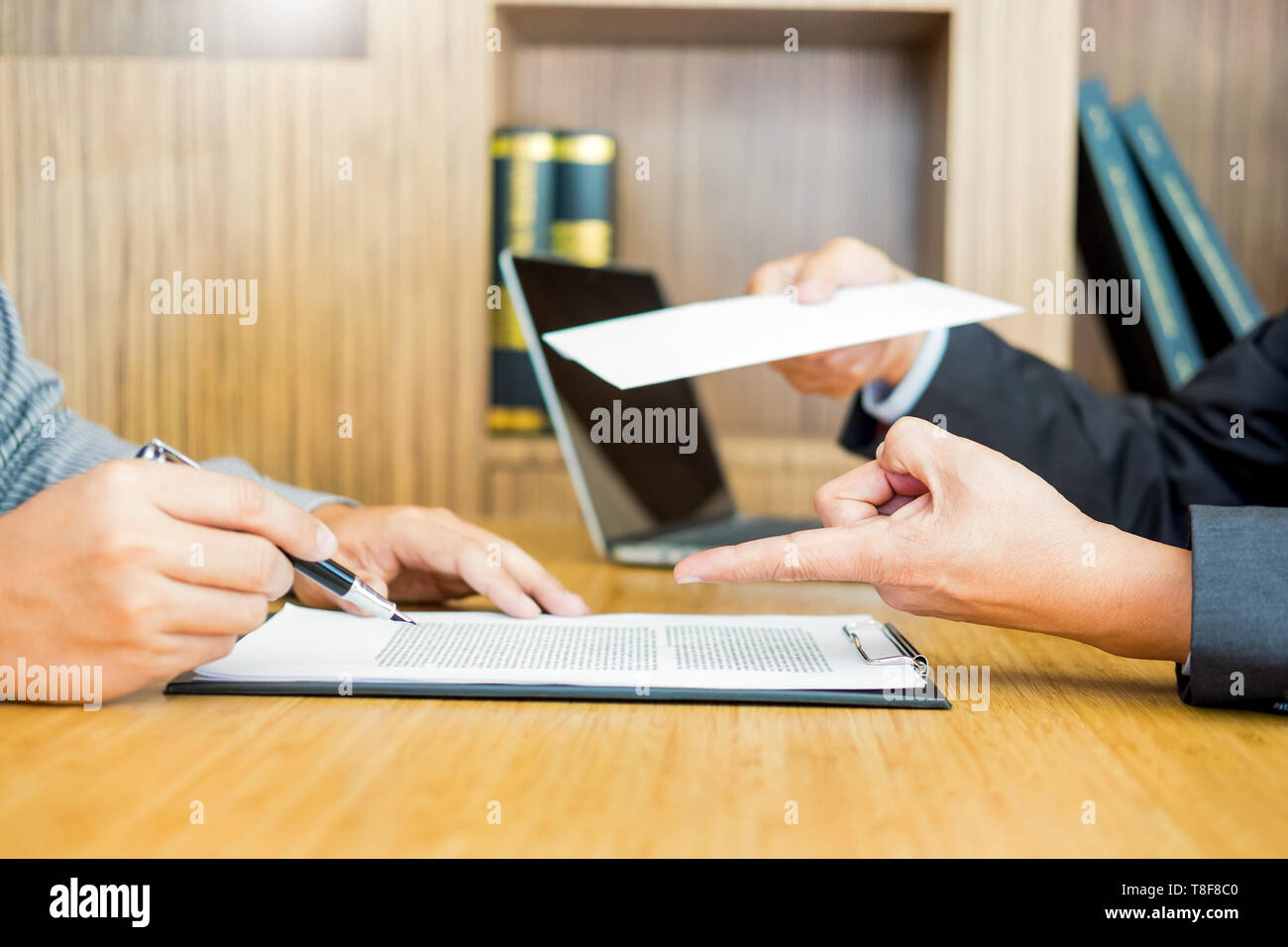 Hand of a businessman hands over a resignation letter final ...