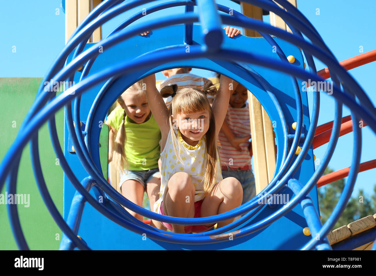 Cute little children having fun on playground outdoors Stock Photo - Alamy