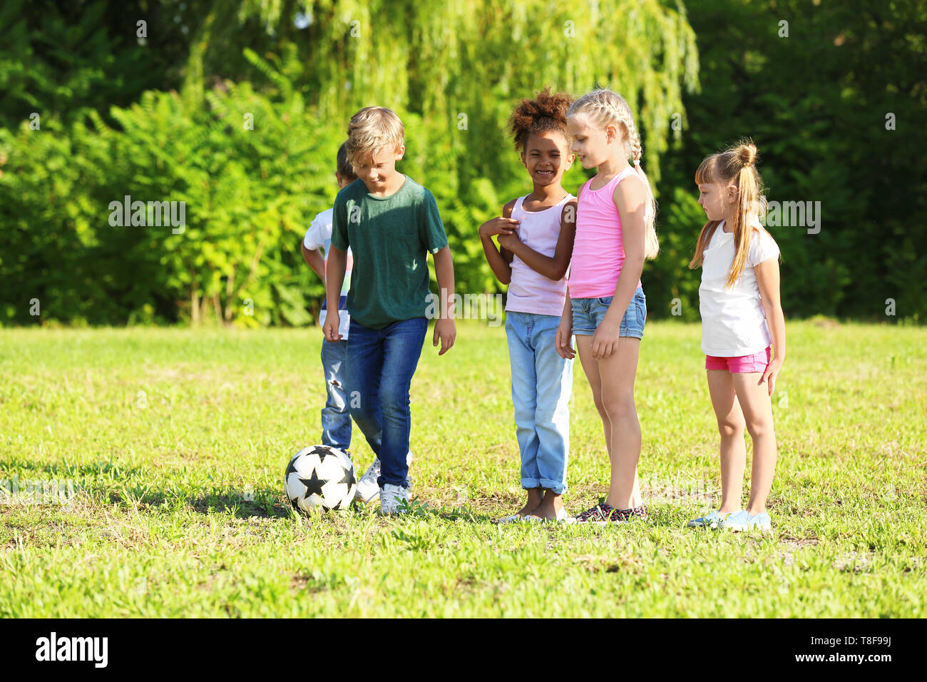 Cute little children playing outdoors Stock Photo - Alamy