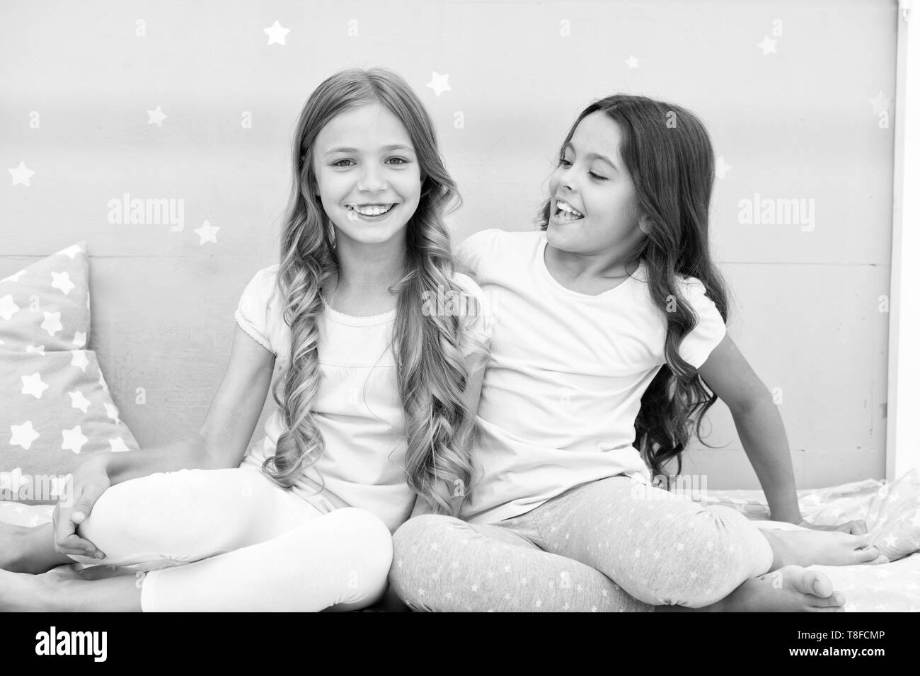 Girls sisters spend pleasant time communicate in bedroom. Sisters older ...