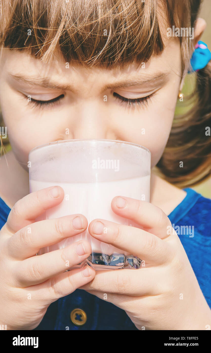 The child drinks milk. Selective focus. Kids Stock Photo - Alamy