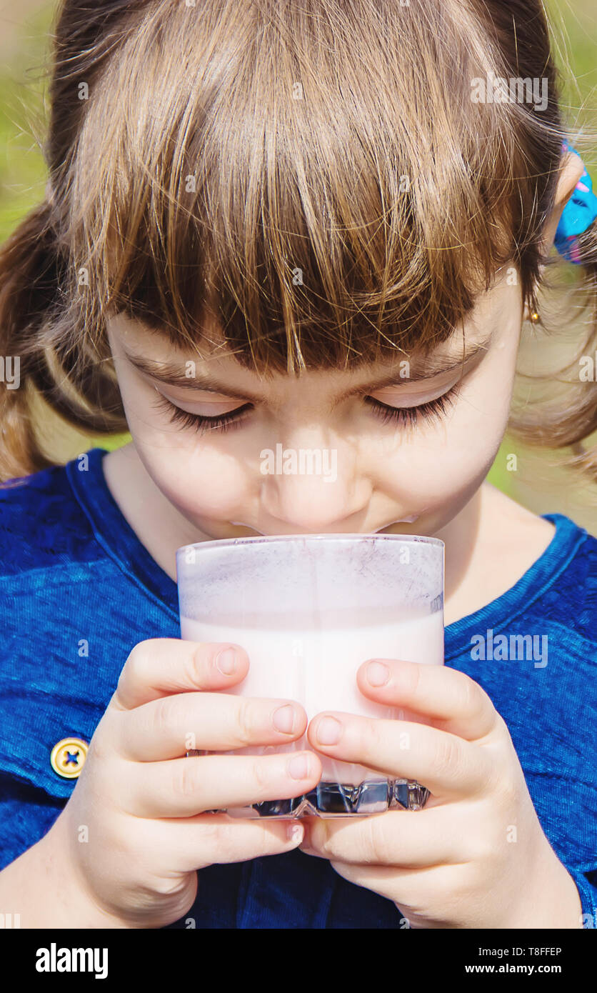 The child drinks milk. Selective focus. Kids Stock Photo - Alamy