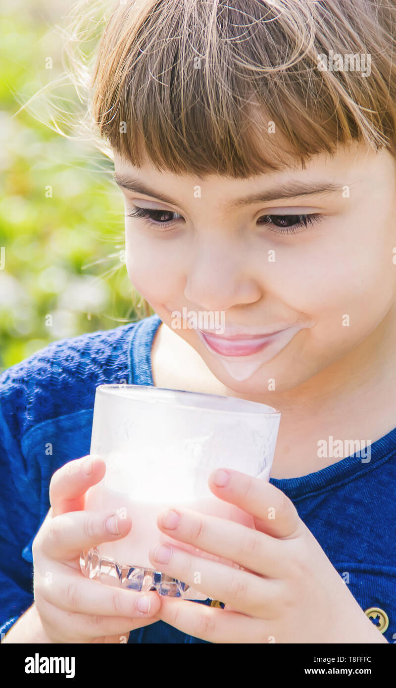 The child drinks milk. Selective focus. Kids Stock Photo - Alamy