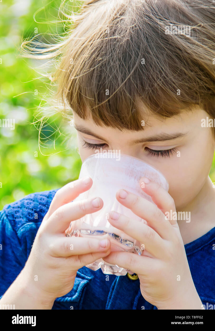 The child drinks milk. Selective focus. Kids Stock Photo - Alamy