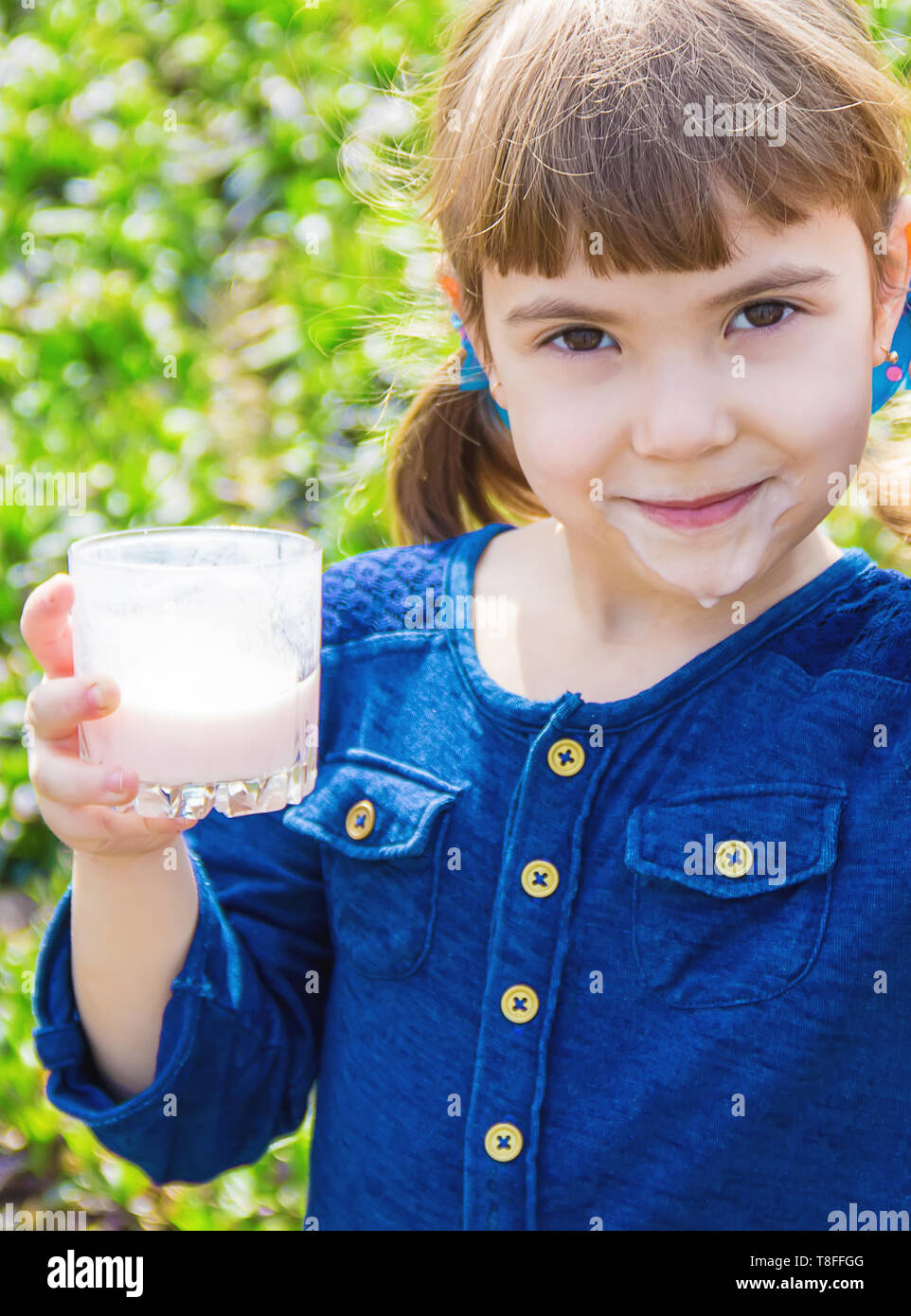 The child drinks milk. Selective focus. Kids Stock Photo - Alamy