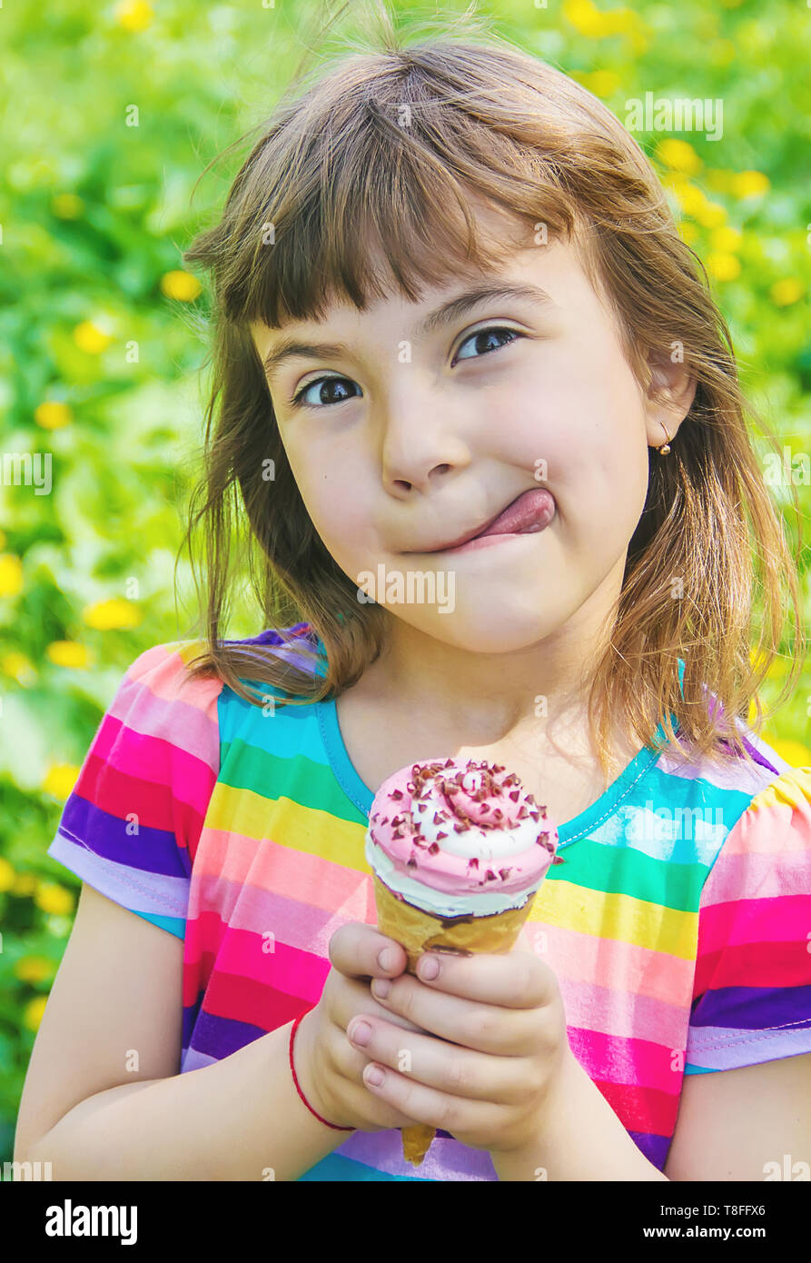 The child eats ice cream. Selective focus Stock Photo - Alamy