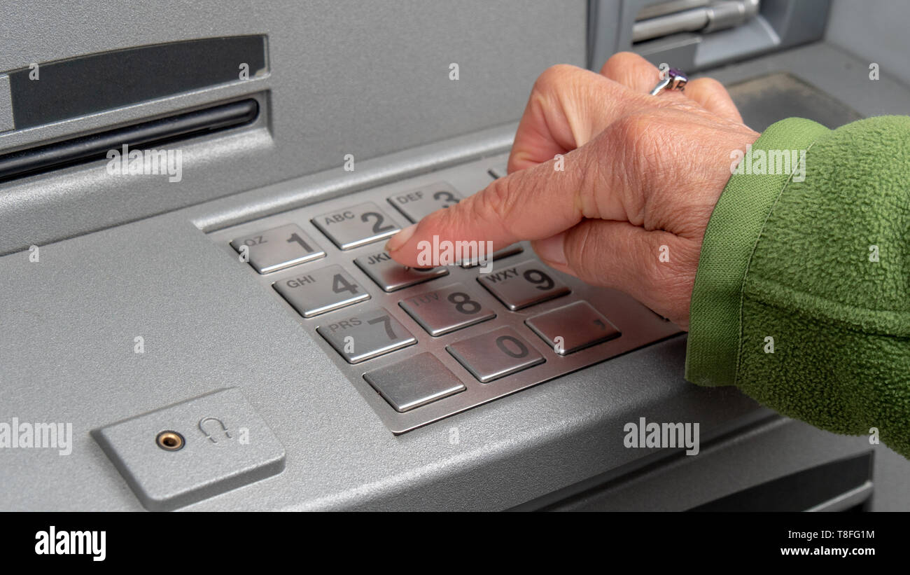Woman enters code from bank hi-res stock photography and images - Alamy
