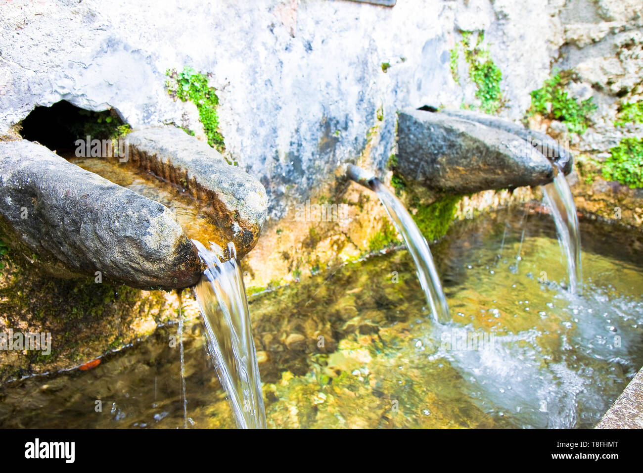 Stone source of drinking water comes from a mountain - image with copy ...