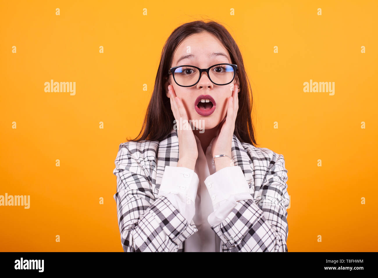 Close up portrait of pretty teenage girl with amazed facial expression ...