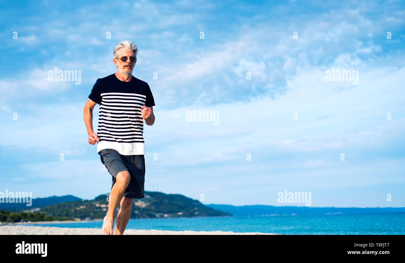 Old man running young hi-res stock photography and images - Alamy