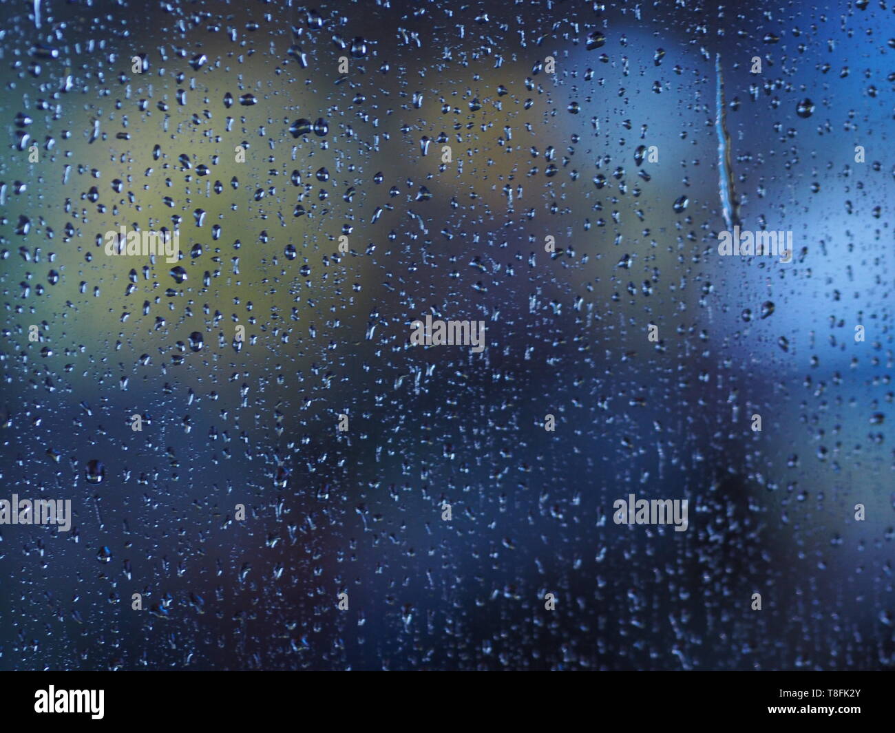Rain Drops on the Window Glass photo in car effect blue color water ...