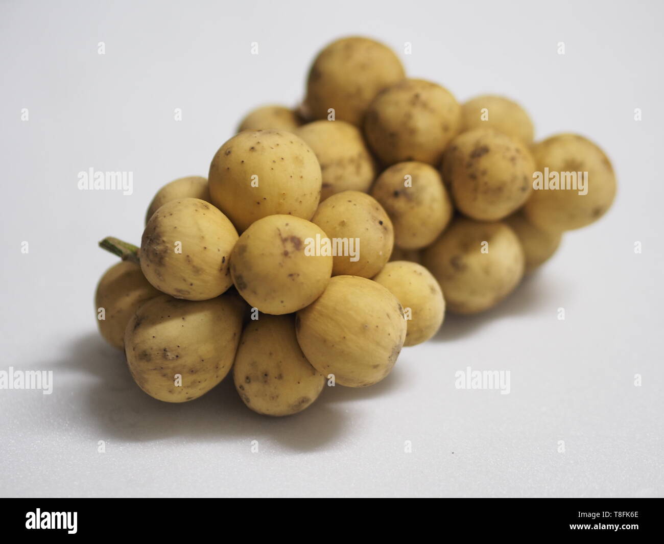 southern langsat Thai fruit on white background Stock Photo - Alamy