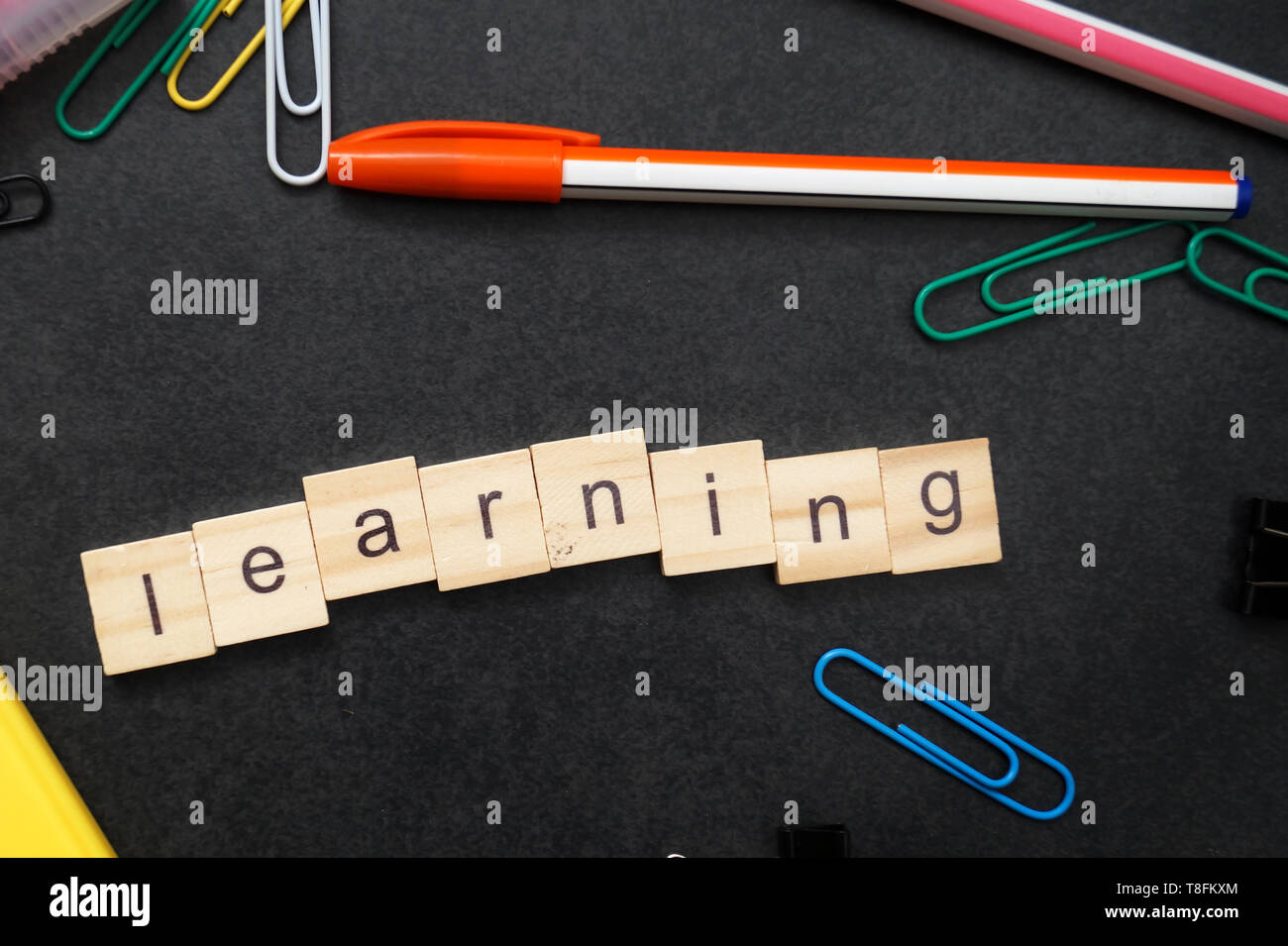 LEARNING word written on wood block, from above Stock Photo - Alamy