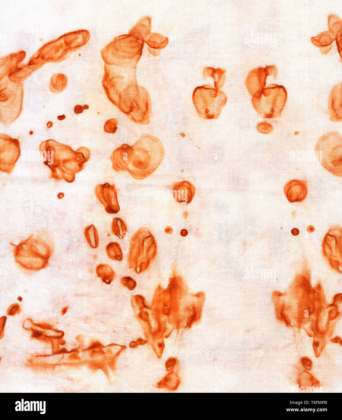 Rust spots on white cloth. Smooth smoky contours, bright rust color ...
