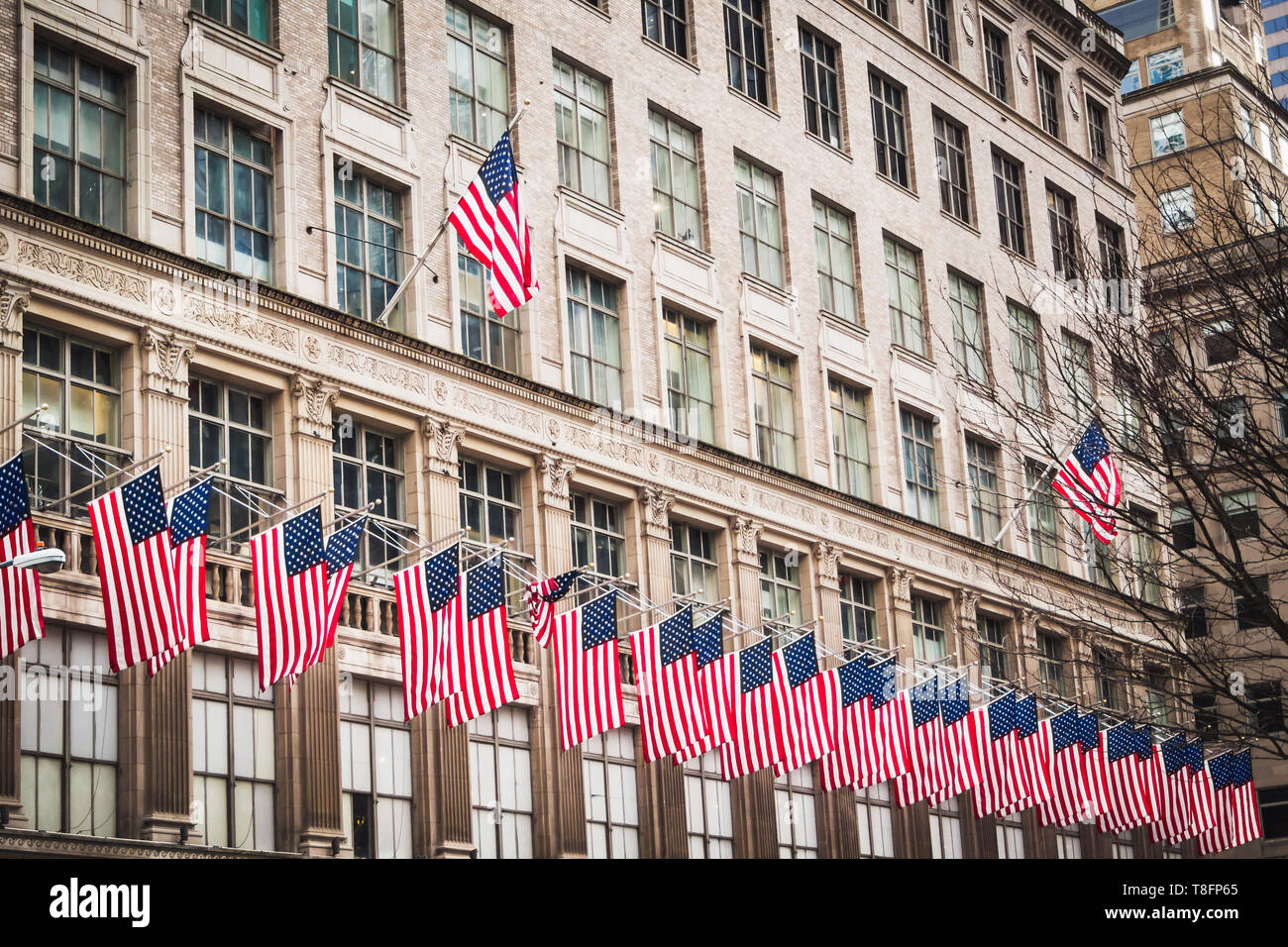 Line of American flags on the streets of Manhattan in New York City ...