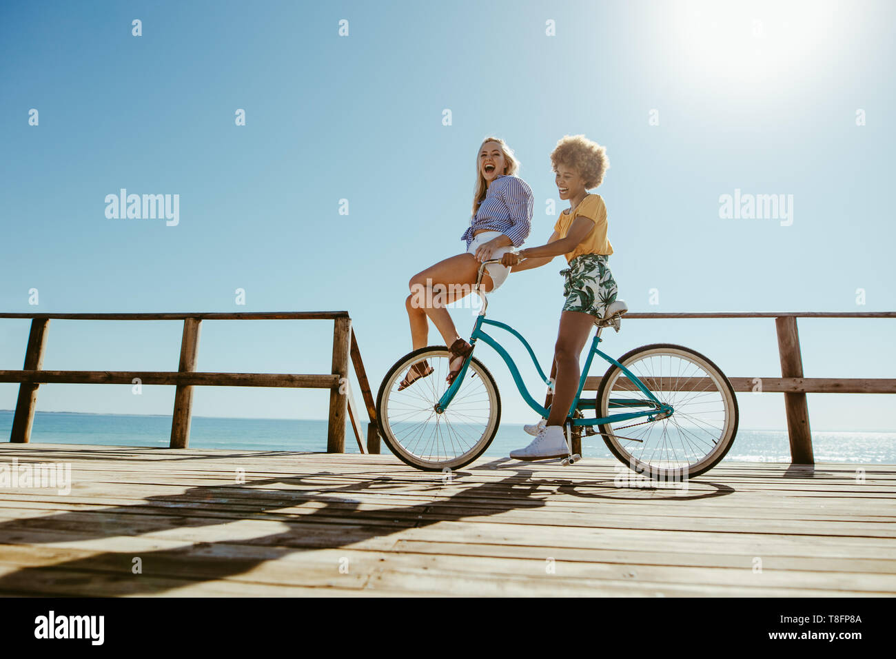 Girls Riding A Bike High Resolution Stock Photography and Images - Alamy