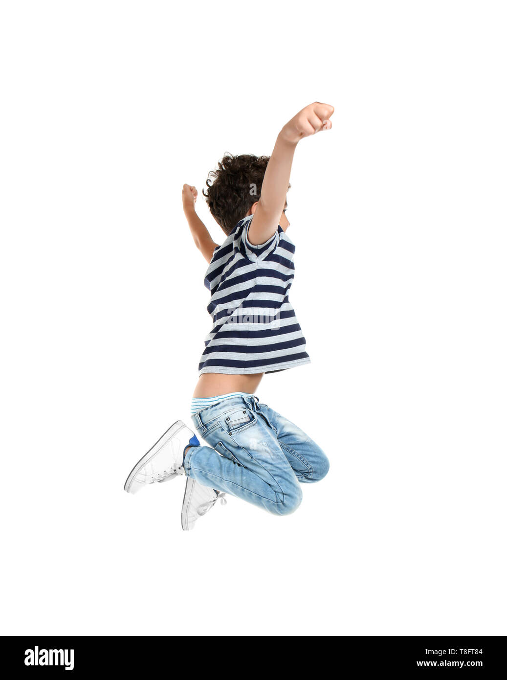 Cute little boy jumping on white background Stock Photo - Alamy