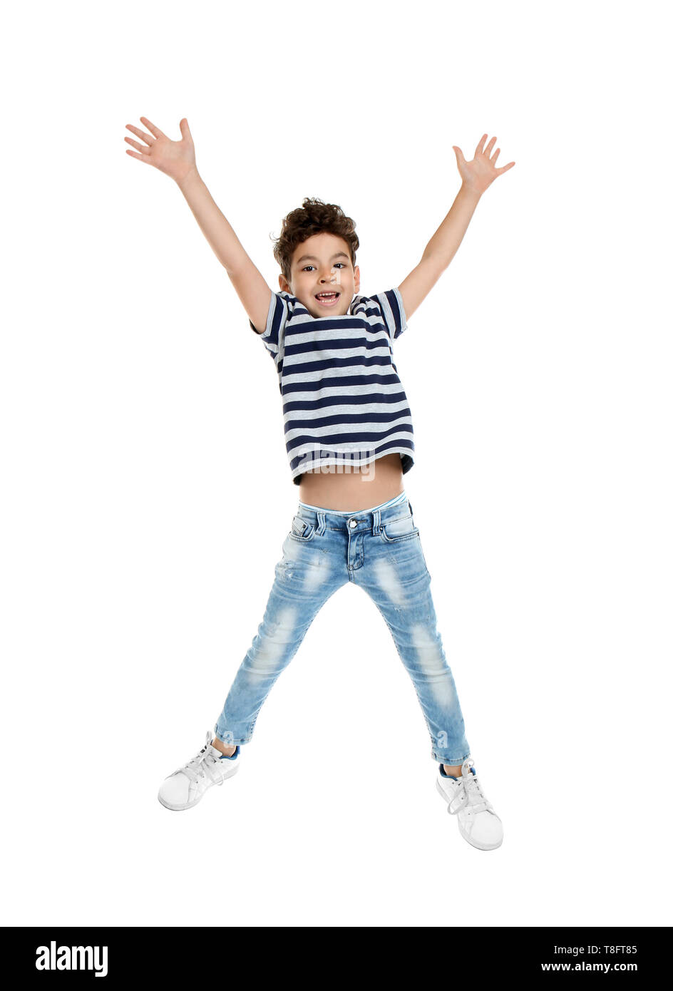 Cute little boy jumping on white background Stock Photo - Alamy