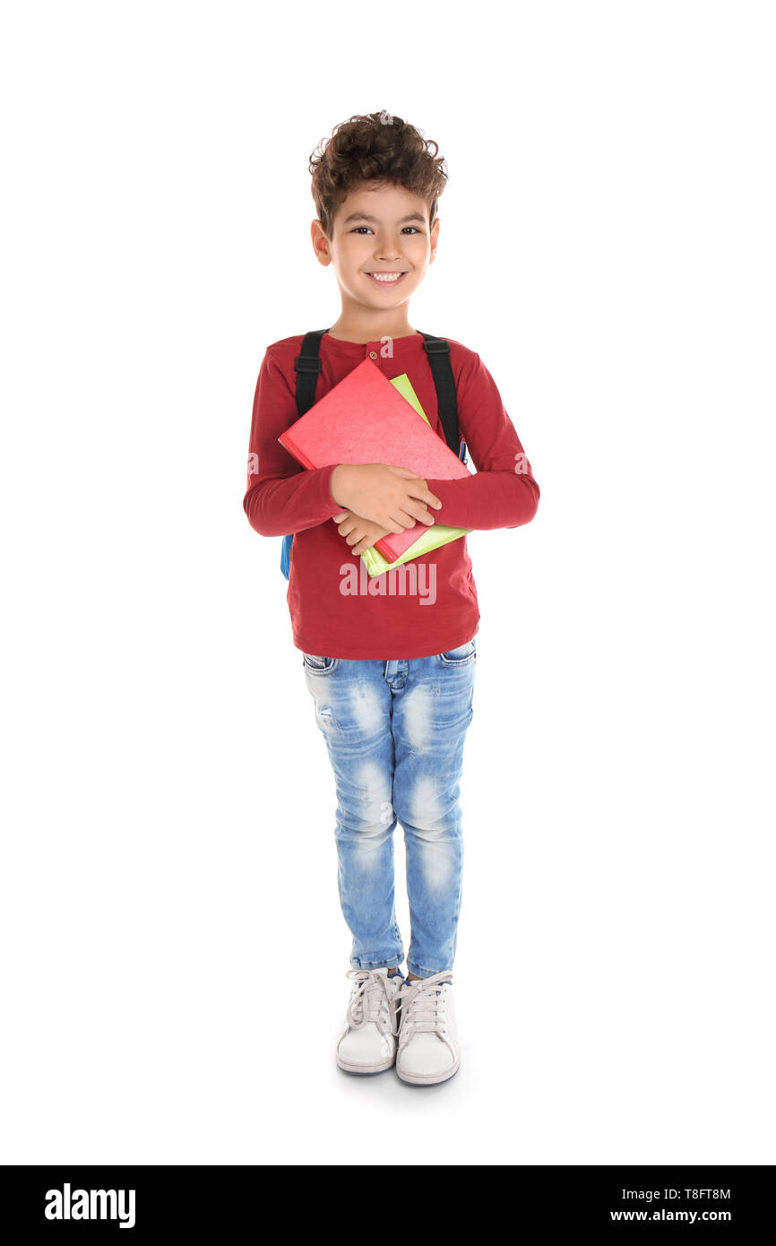 Cute little boy with books on white background Stock Photo - Alamy
