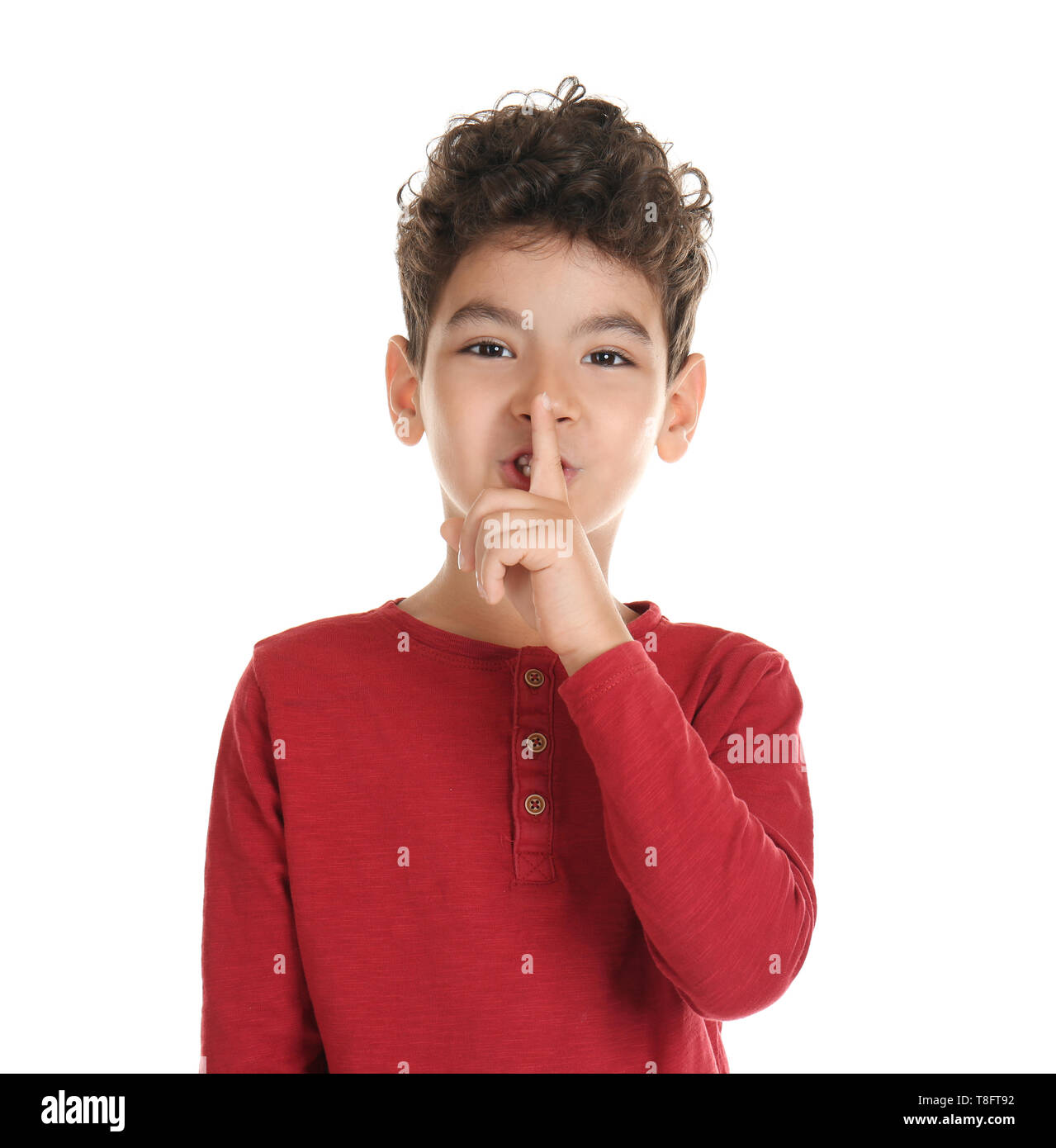 Cute little boy showing silence gesture on white background Stock Photo ...