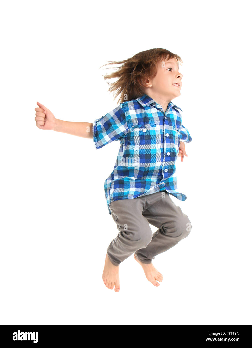 Cute little boy jumping on white background Stock Photo - Alamy