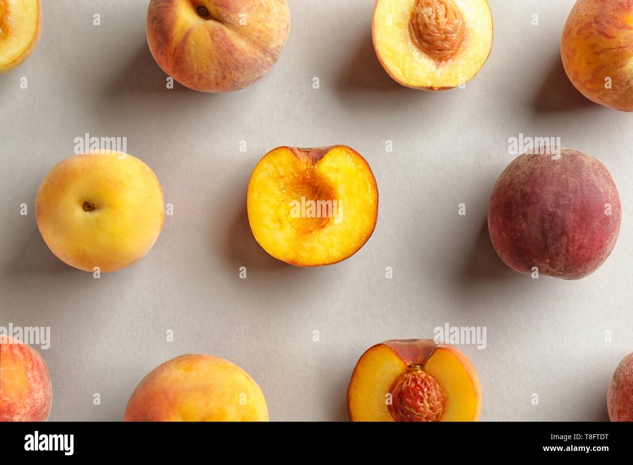 Fresh peaches on light table Stock Photo - Alamy