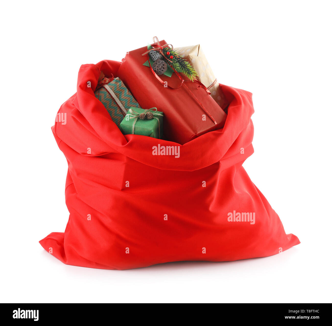 Santa Claus bag full of gifts on white background Stock Photo - Alamy