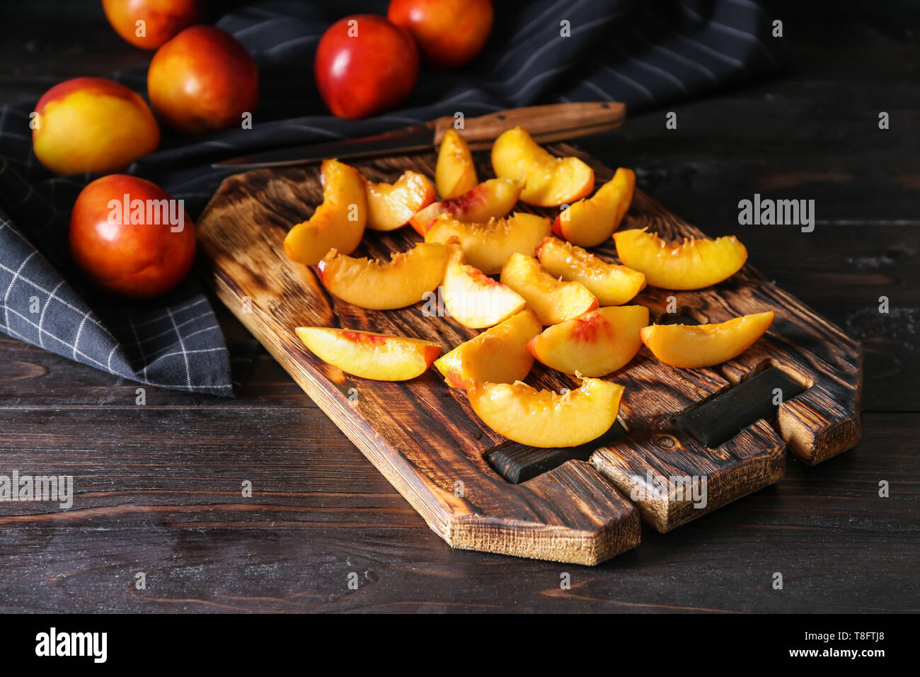 Wooden board sliced peaches hi-res stock photography and images - Alamy