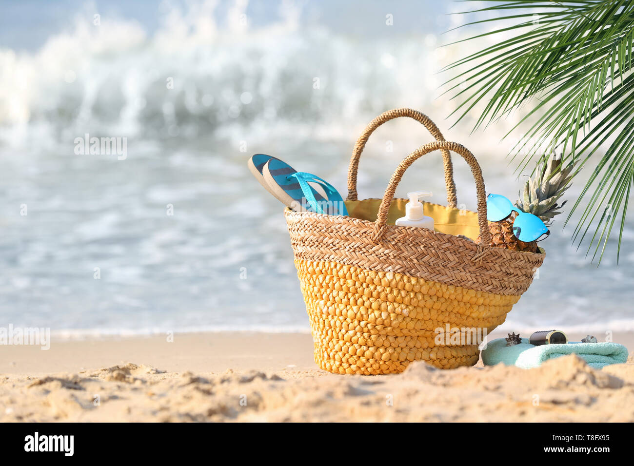 Set of beach items on sand near sea Stock Photo - Alamy