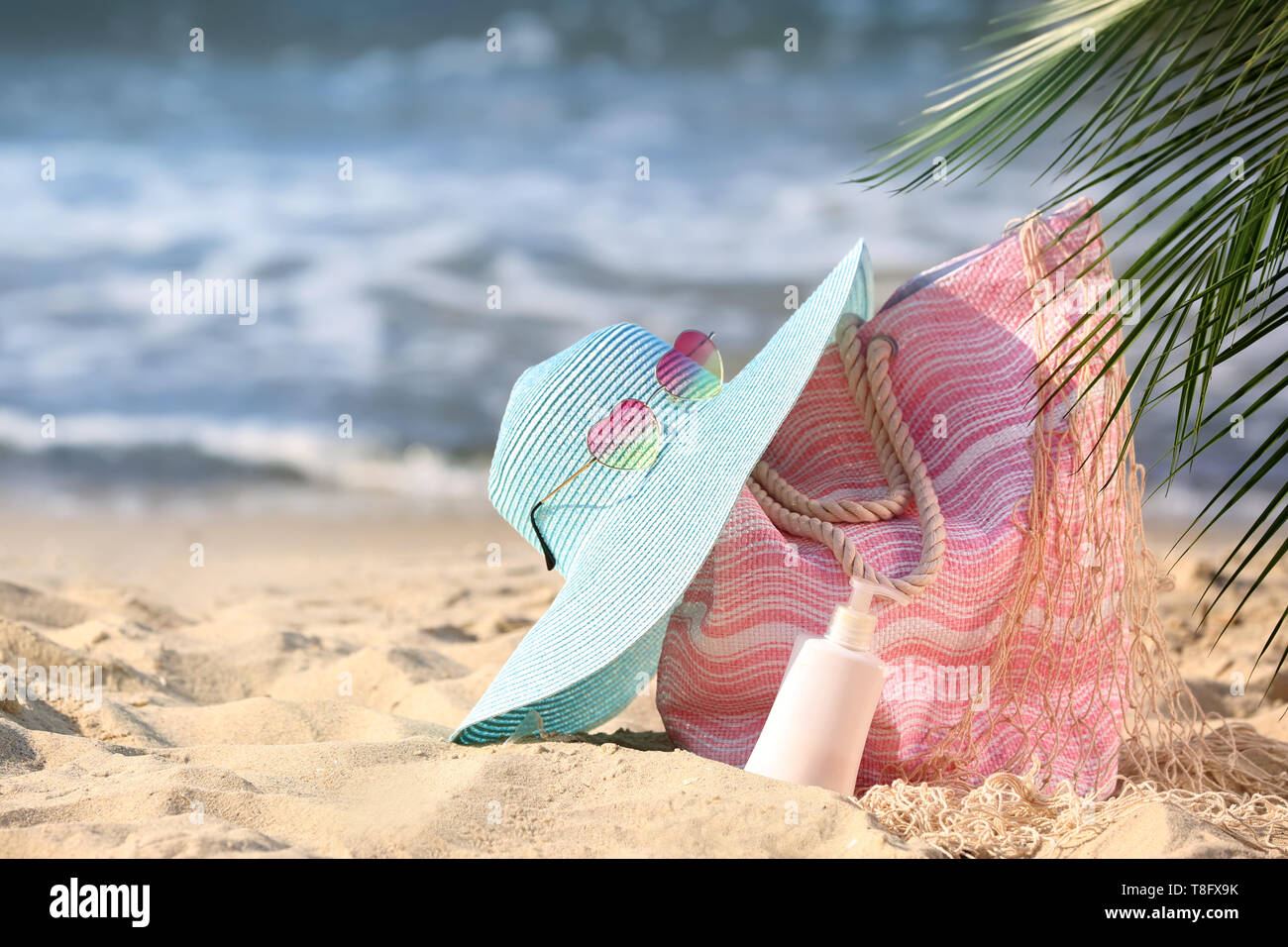 Set of beach items on sand near sea Stock Photo - Alamy
