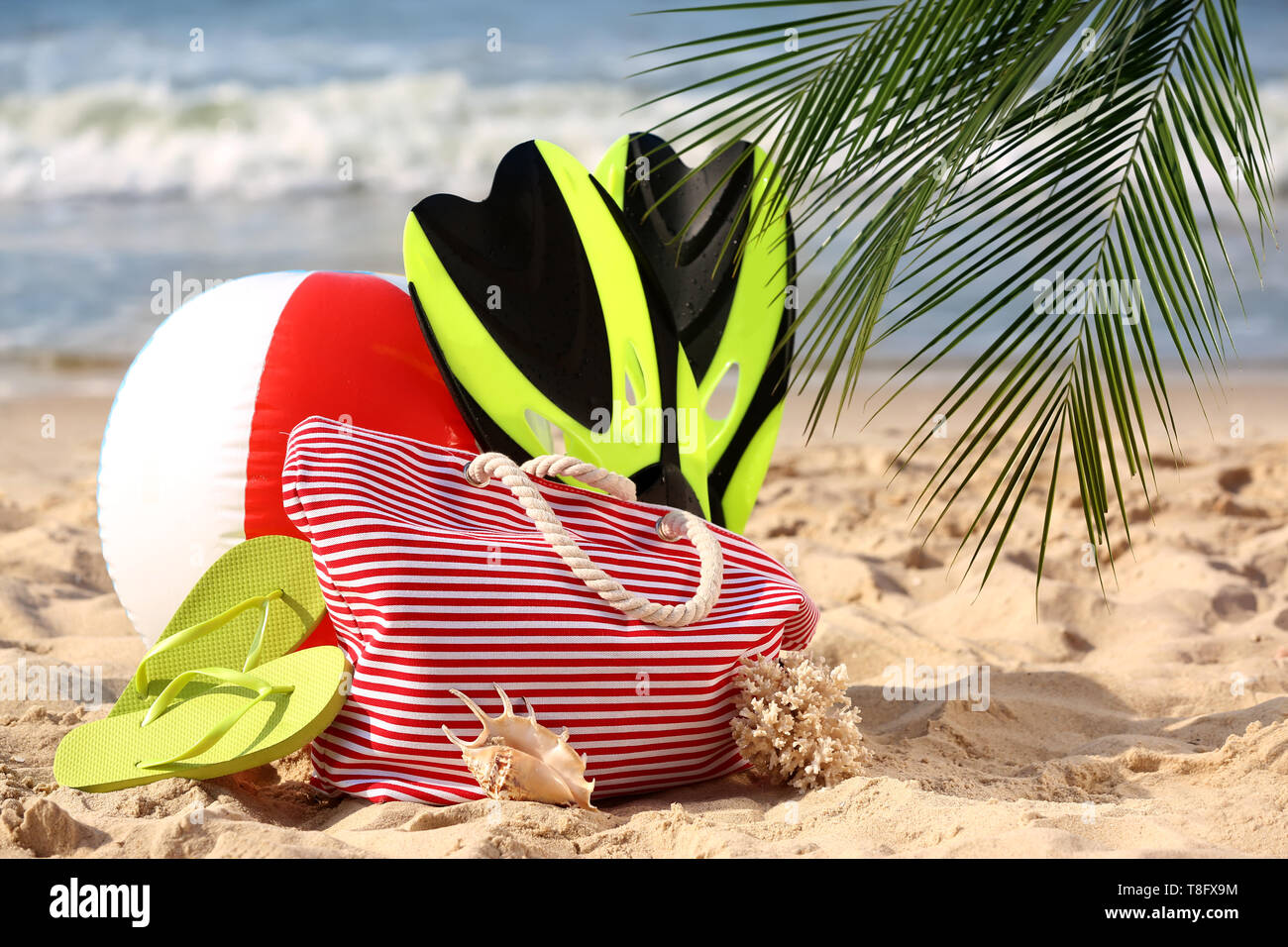 Set of beach items on sand near sea Stock Photo - Alamy