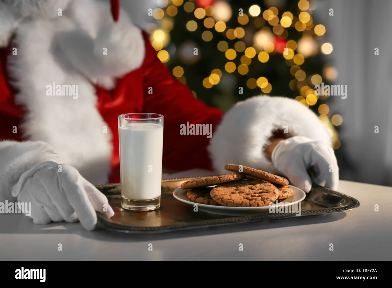Santa claus eating cookies hi-res stock photography and images - Alamy