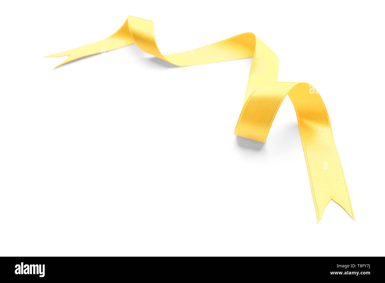 Yellow ribbon on white background Stock Photo - Alamy