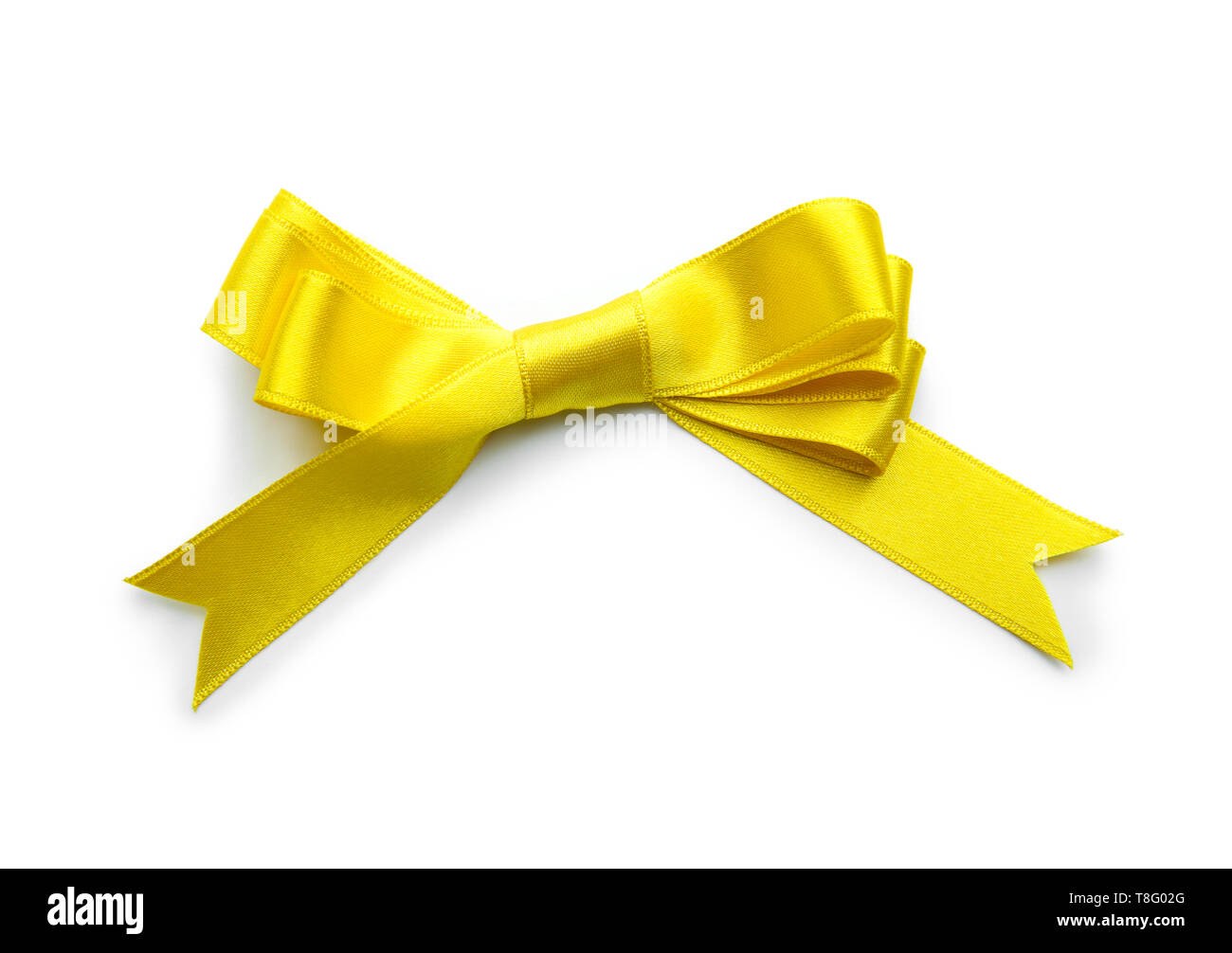 Beautiful bow made from yellow ribbon on white background Stock Photo ...