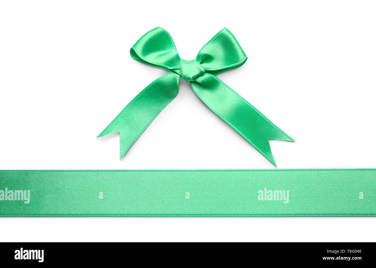 Green ribbon with bow on white background Stock Photo - Alamy