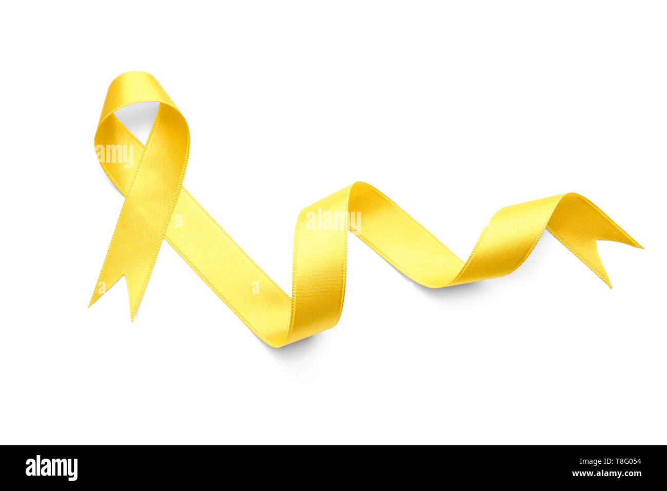 Yellow ribbon on white background. Cancer concept Stock Photo - Alamy