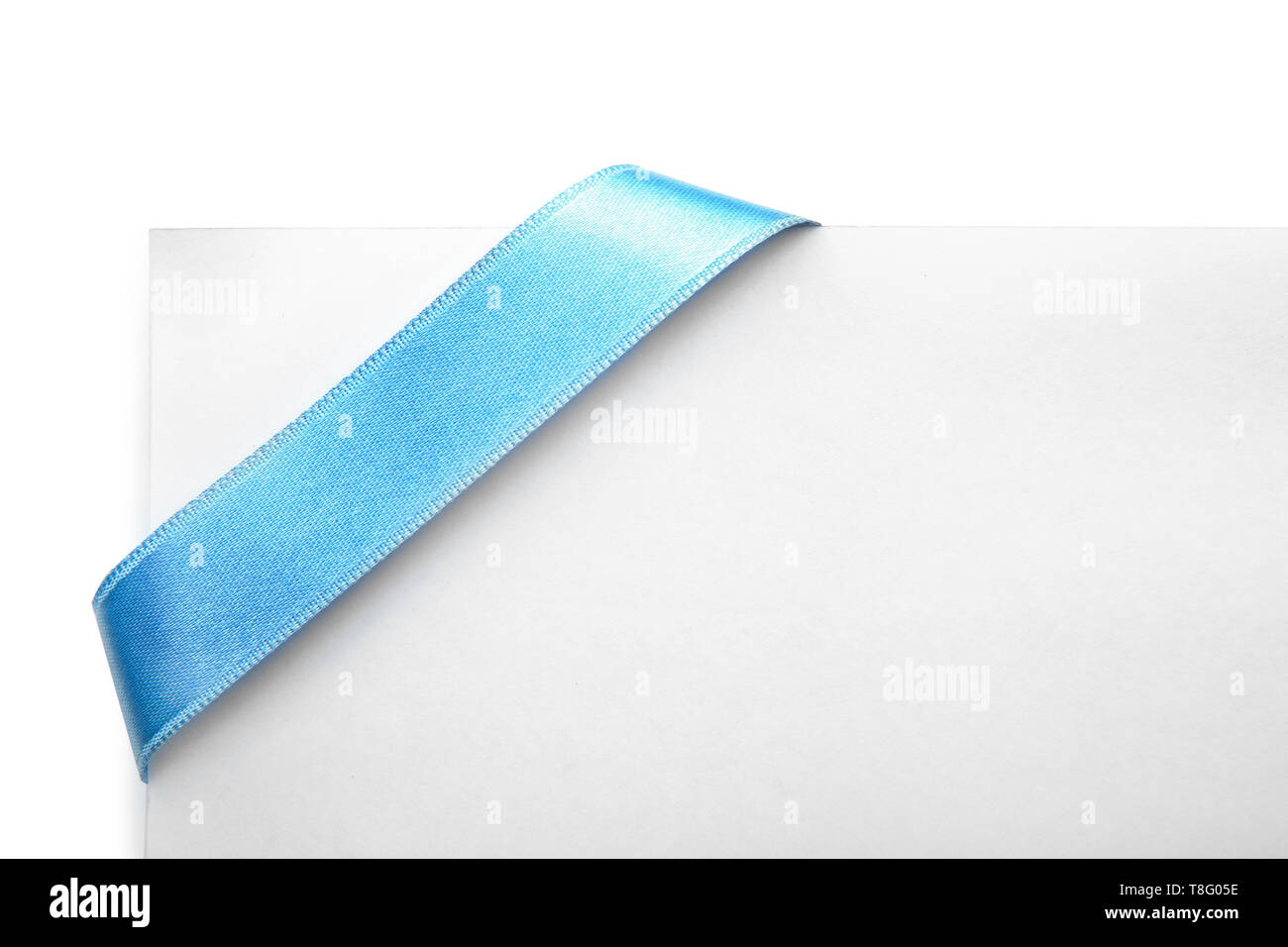 Blank sheet of paper with blue ribbon on white background Stock Photo ...