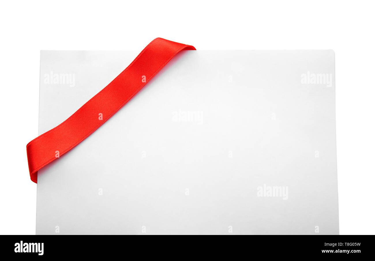 Blank sheet of paper with red ribbon on white background Stock Photo ...