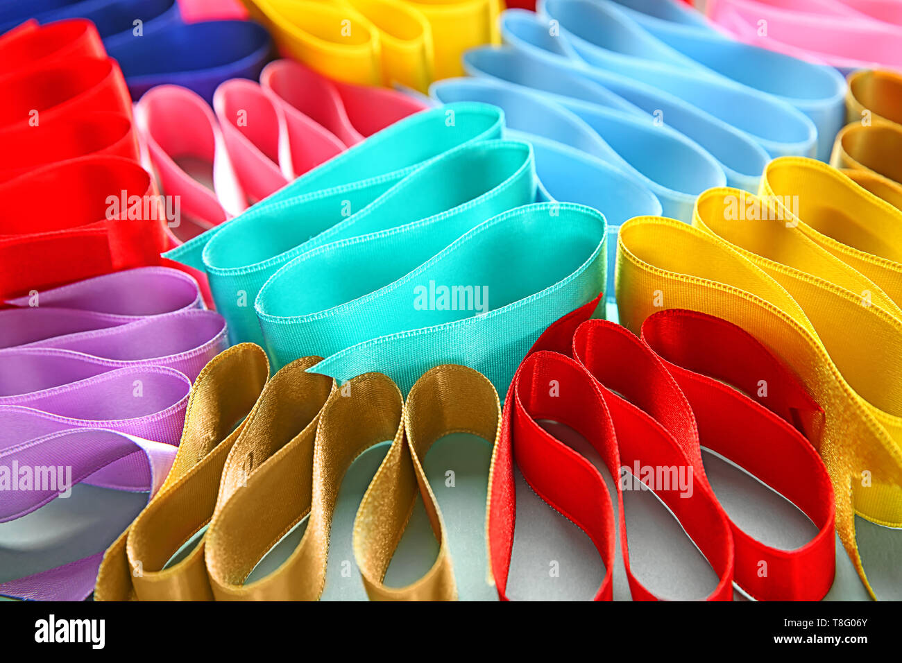 Different ribbons on color background Stock Photo - Alamy