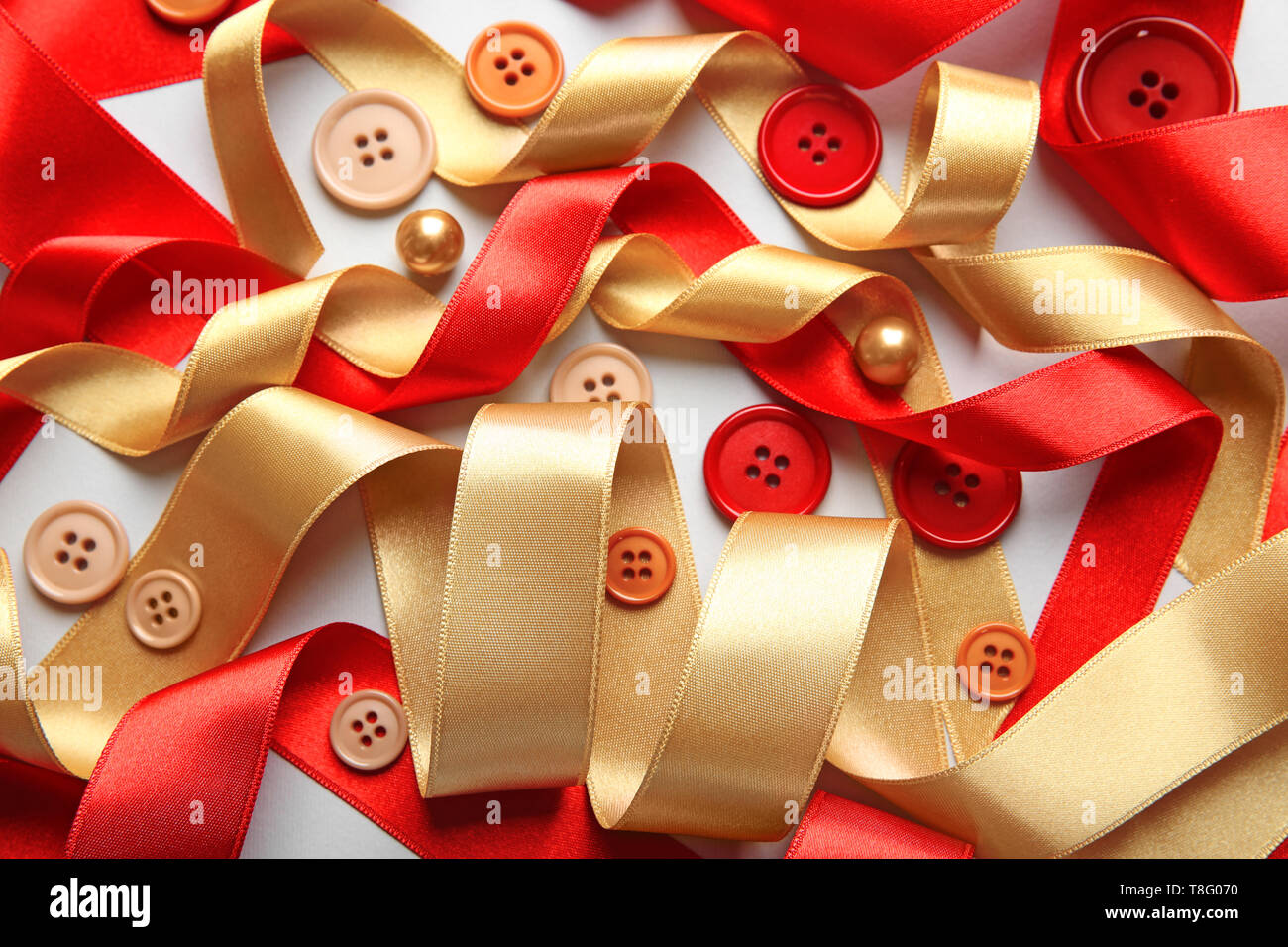 Different ribbons with buttons on white background Stock Photo - Alamy