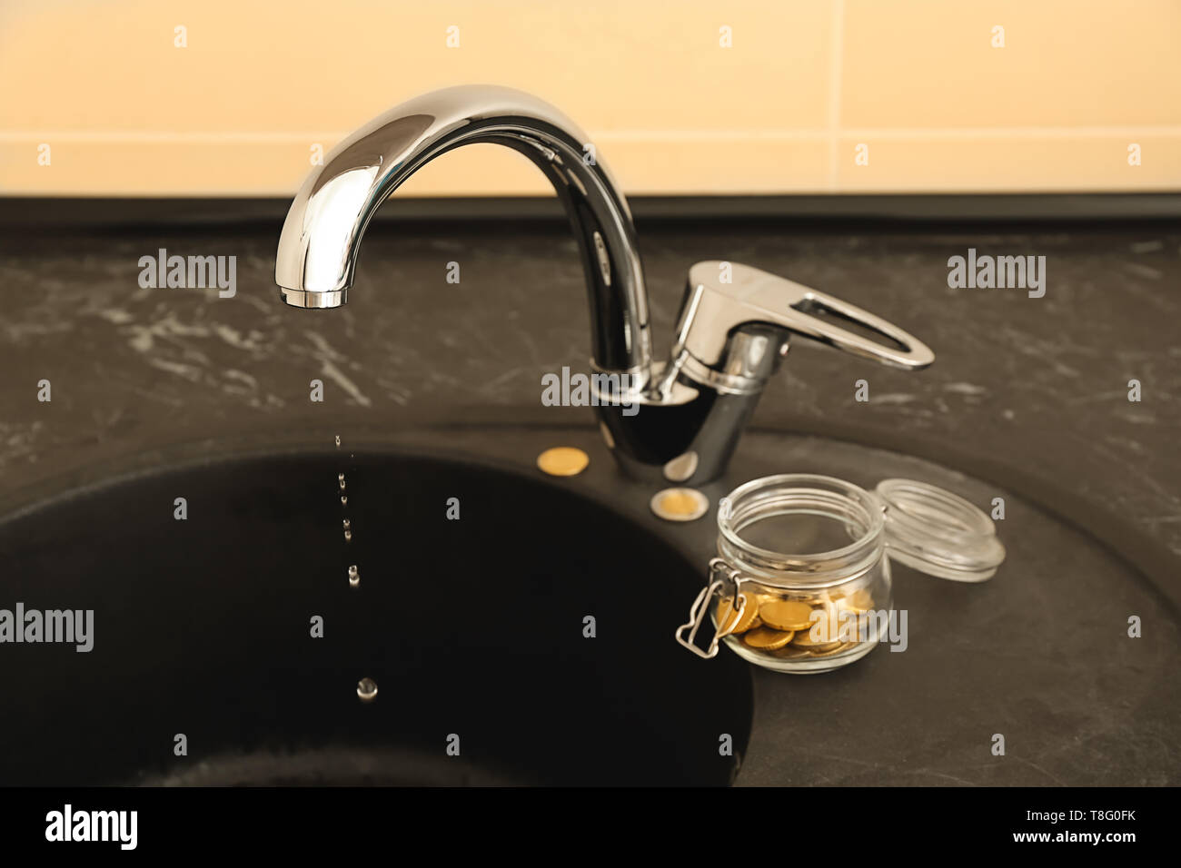 Water drop with coins hi-res stock photography and images - Alamy