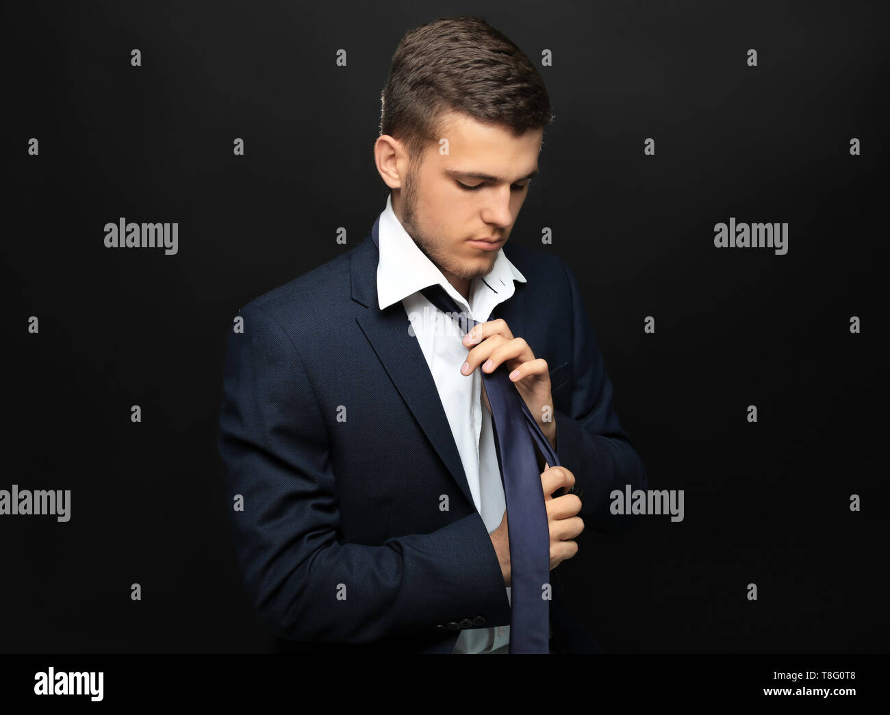 Man fixing tie hi-res stock photography and images - Alamy