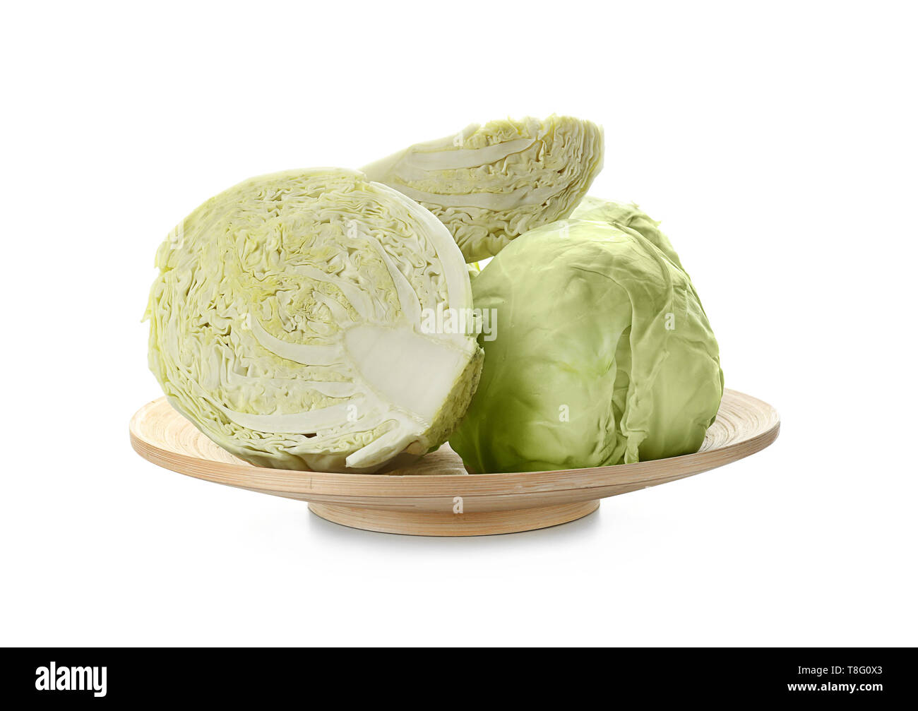 Plate with whole and sliced cabbage on white background Stock Photo - Alamy