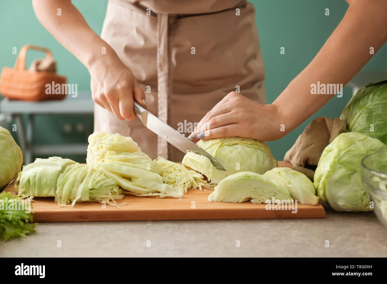 Female hands chopped cabbage hi-res stock photography and images - Alamy