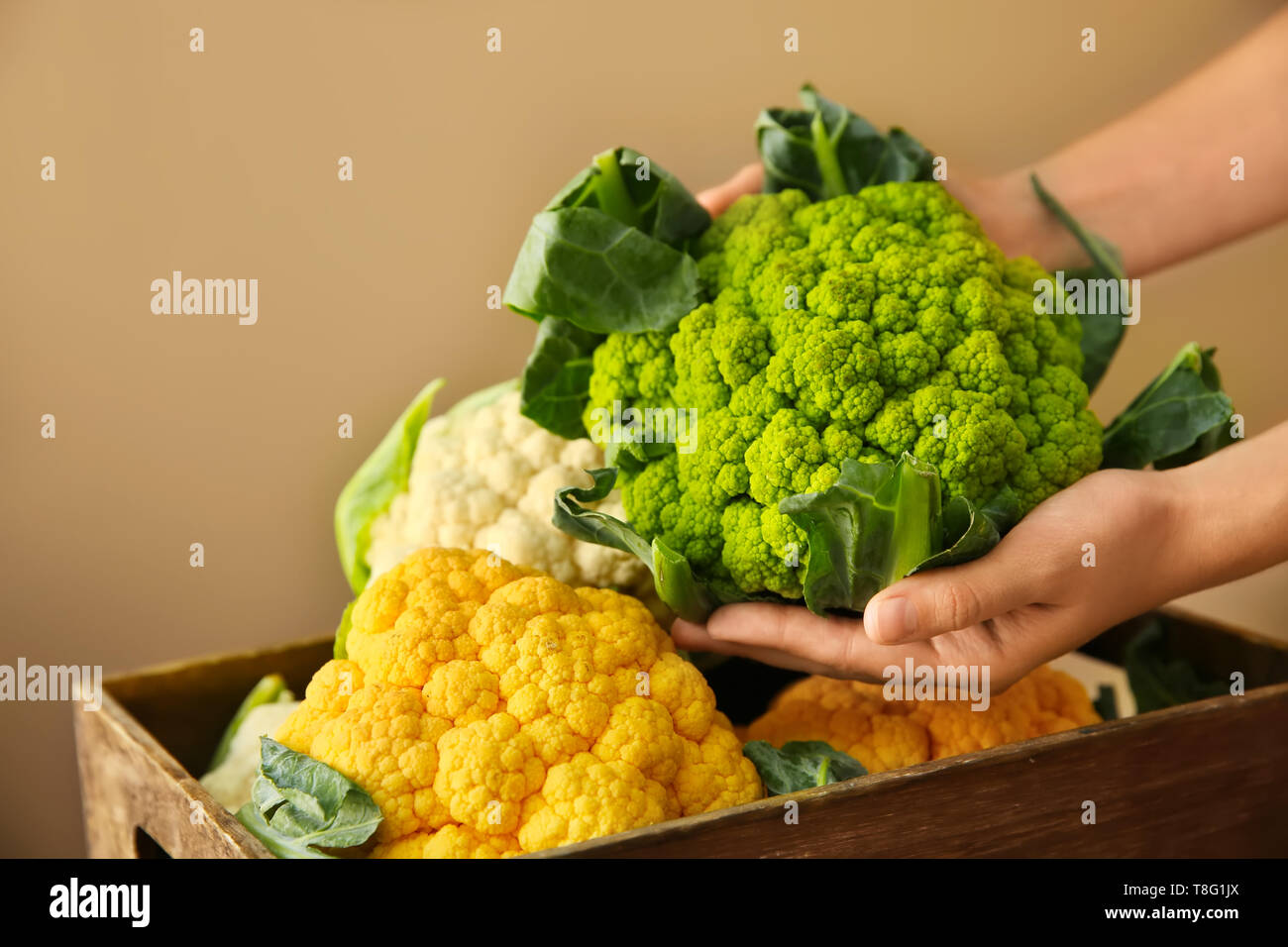 Woman holding green cauliflower hi-res stock photography and images - Alamy