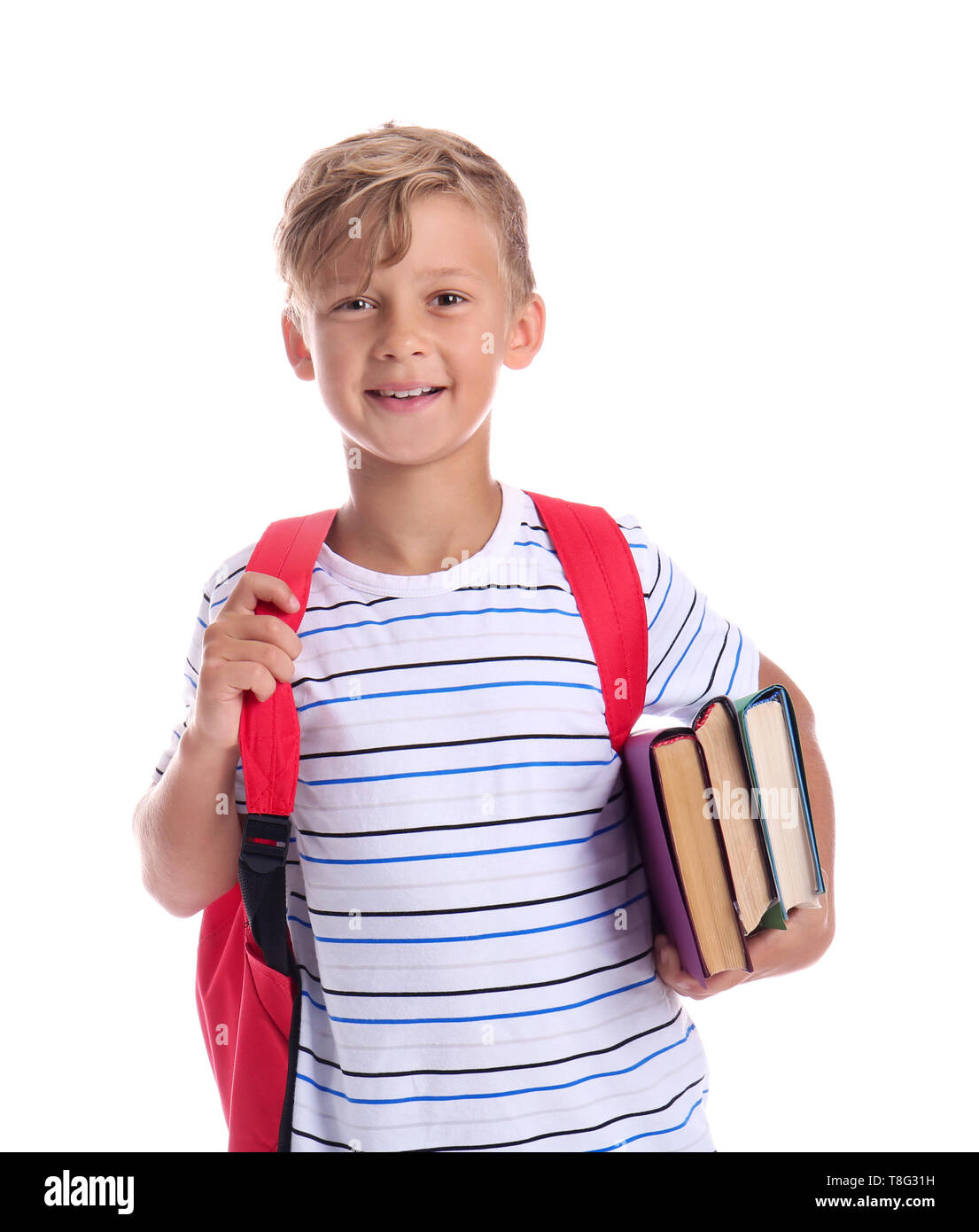 Cute little schoolboy with books on white background Stock Photo - Alamy