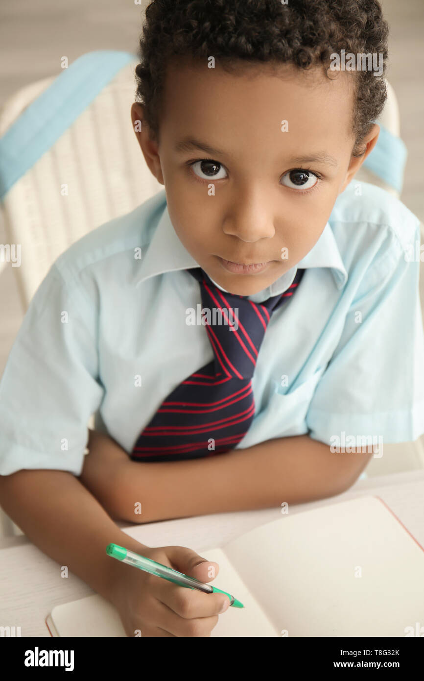 African-American boy doing exercise in classroom Stock Photo - Alamy