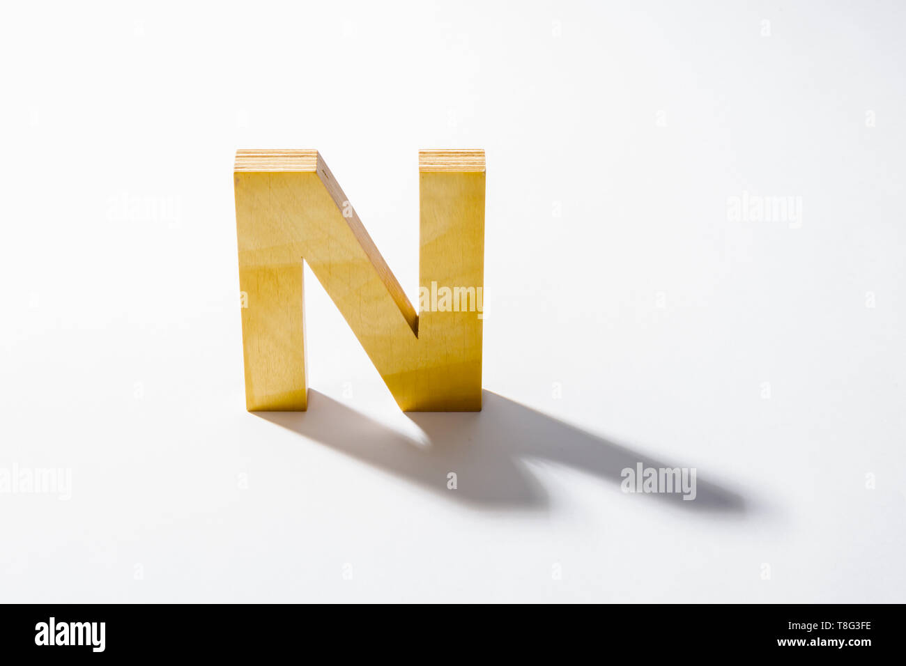 Wooden Alphabet N and Shadow Reflection Stock Photo - Alamy
